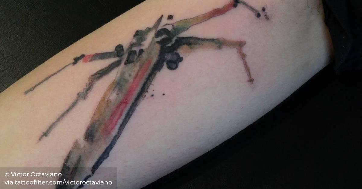 Watercolor style X-Wing Fighter tattoo on the right