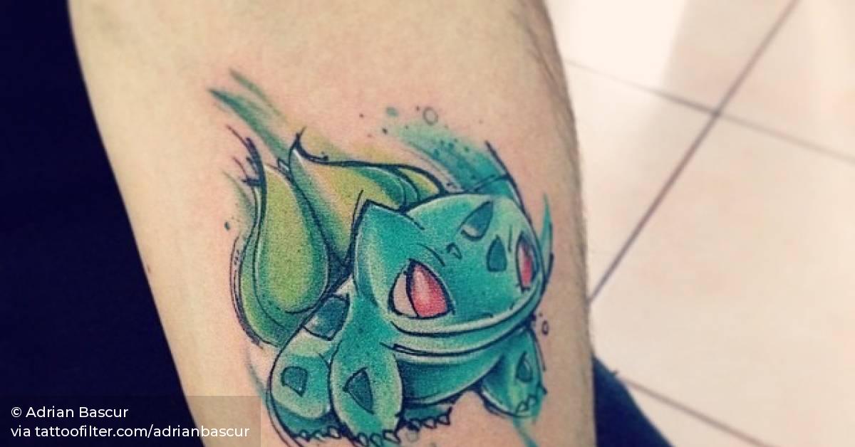 Watercolor style bulbasaur tattoo on the forearm.