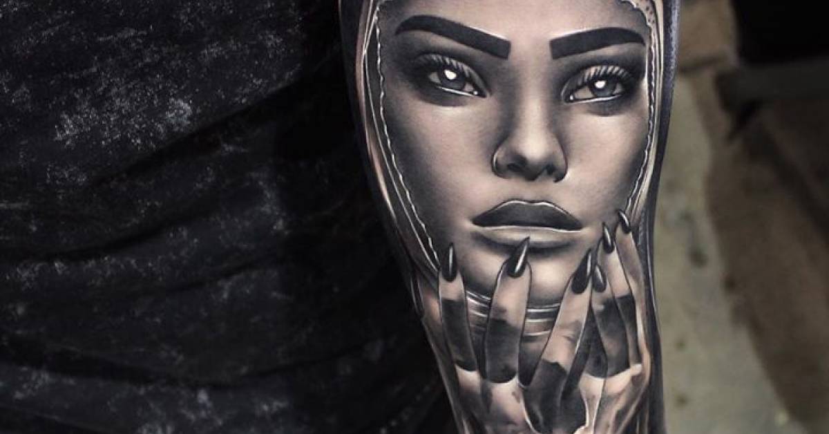 Black and grey nun tattoo on the left inner forearm.