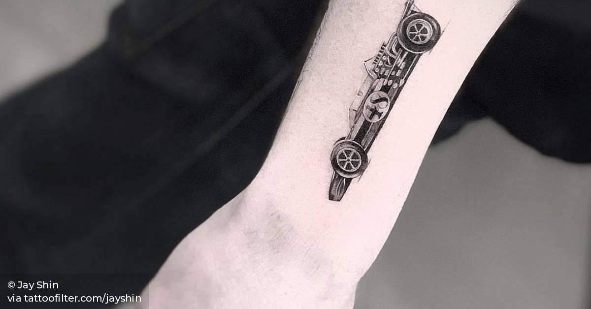 Car tattoo on the forearm.