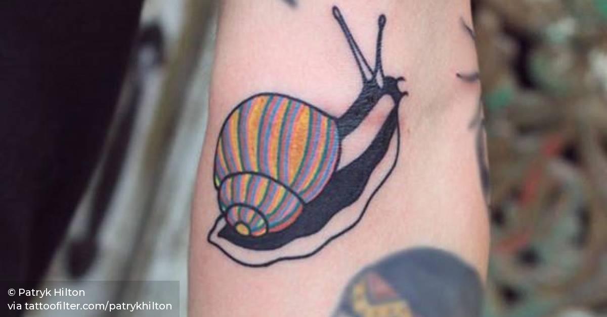 Snail tattoo on the left arm.
