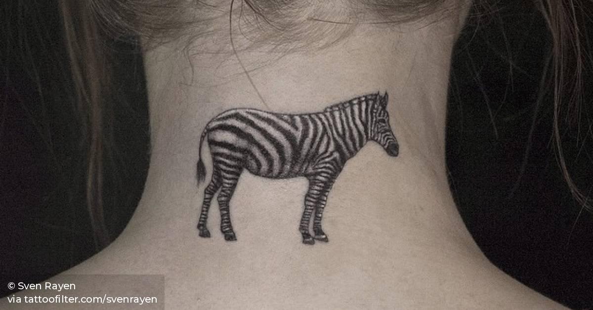 Little zebra tattoo on the back of the neck.