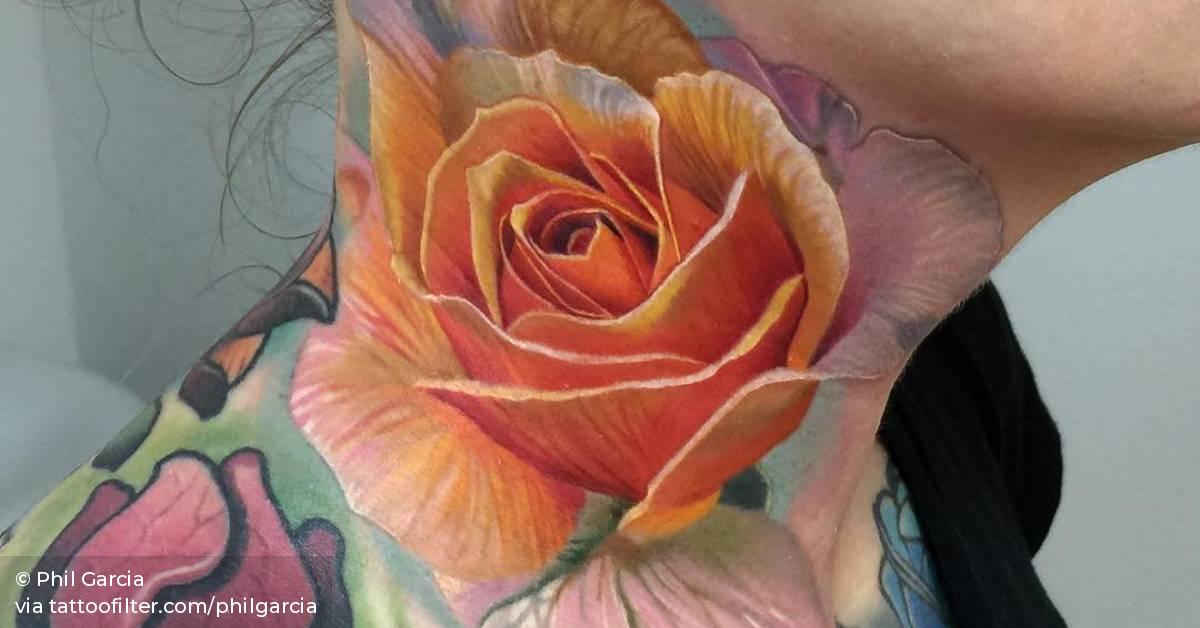 Realistic orange rose on the right side of the neck.