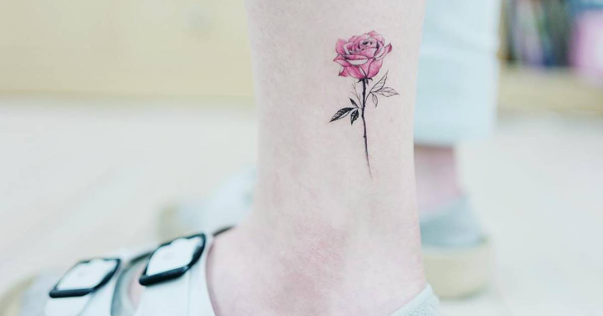 Pink rose tattoo on the ankle.