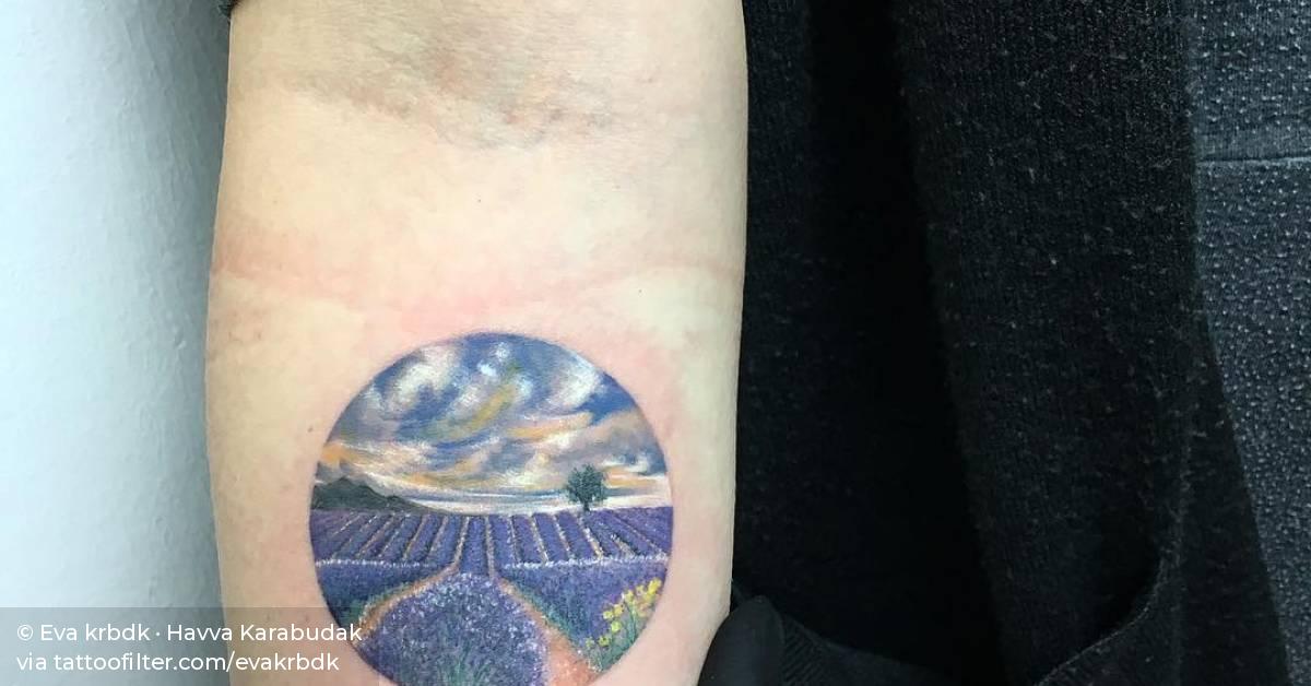 Lavender field tattoo on the right inner forearm.