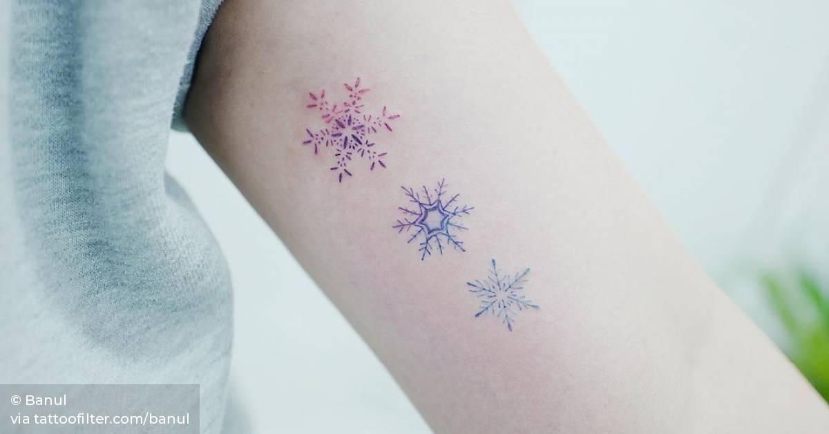 Three snowflakes on the left inner arm.