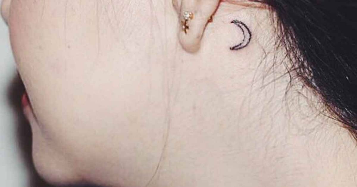 Little behind the ear tattoo of the moon on Mary.