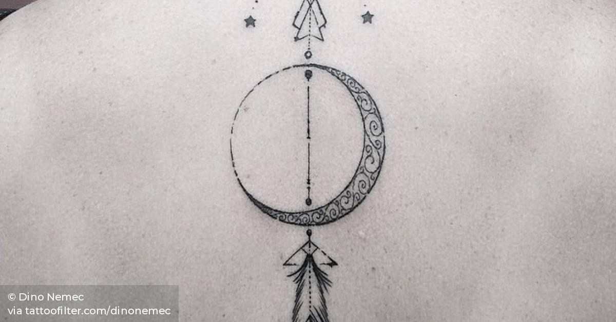 Fine line moon-arrow tattoo on the back.