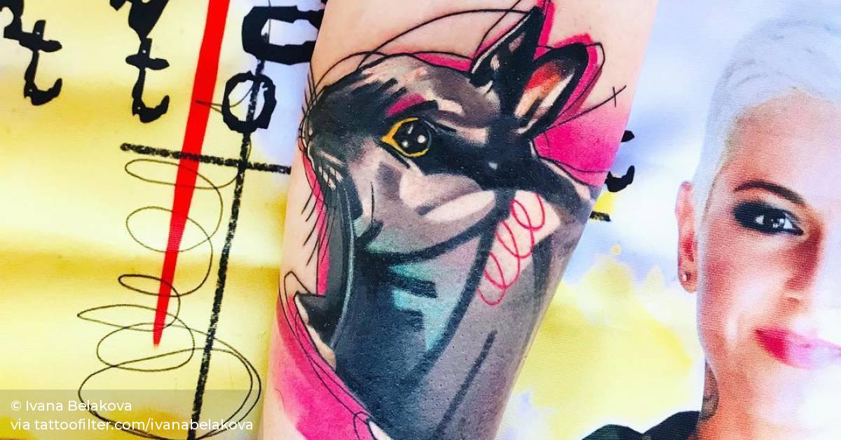Watercolor rabbit tattoo on the inner forearm.