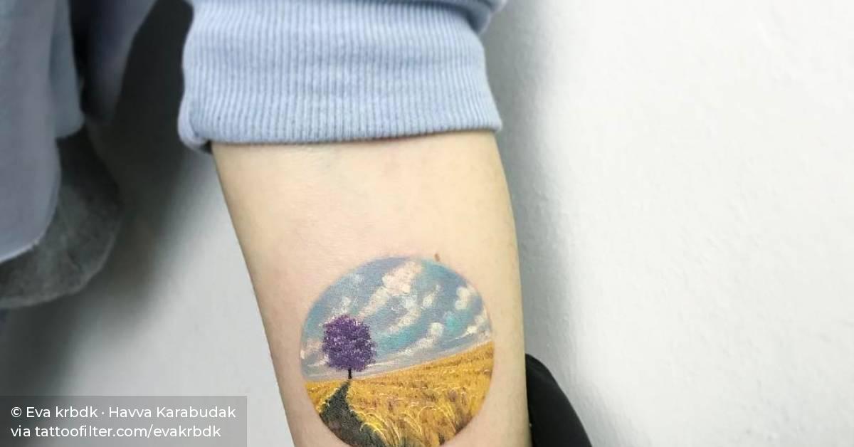 Wheat field tattoo on the left inner forearm.