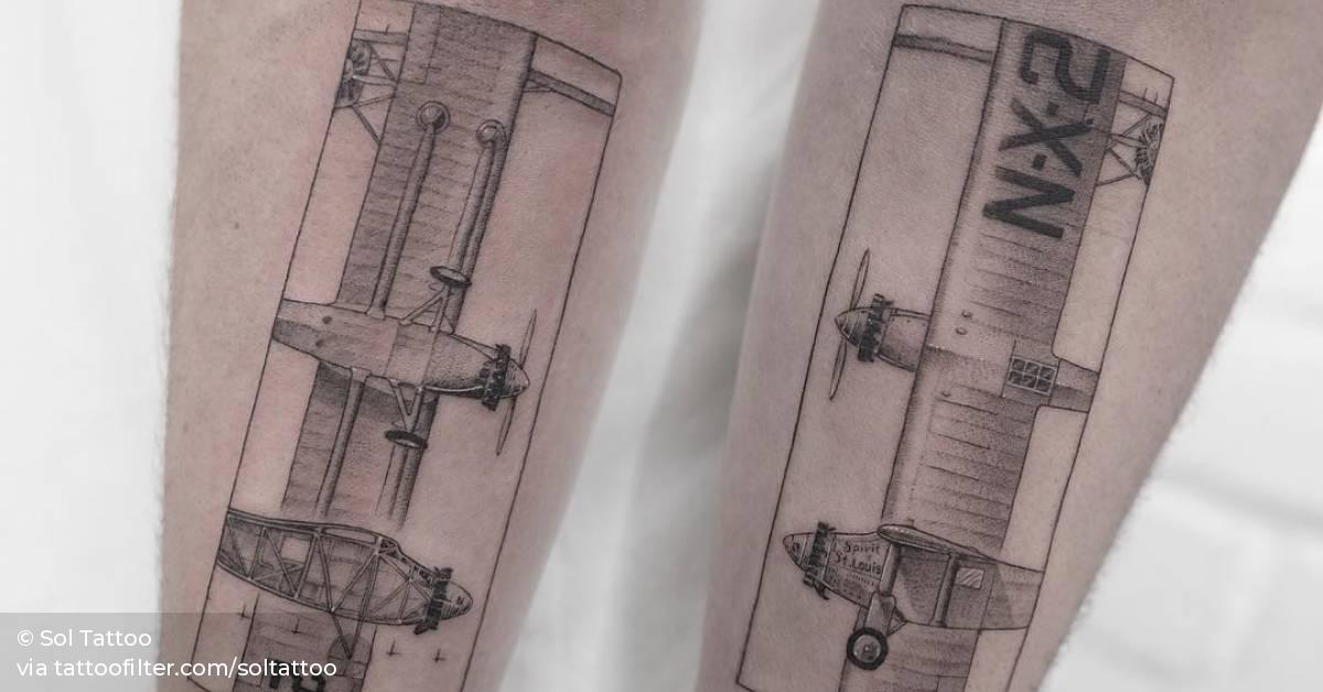 Matching light aircraft tattoo.