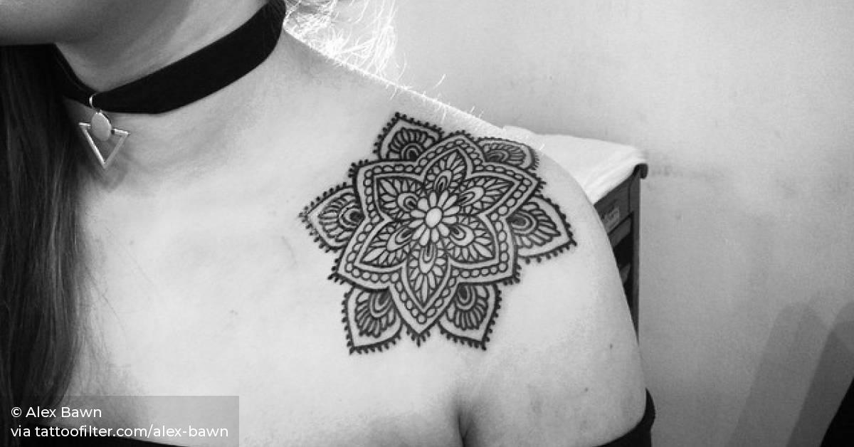 Ornamental style mandala on the shoulder.