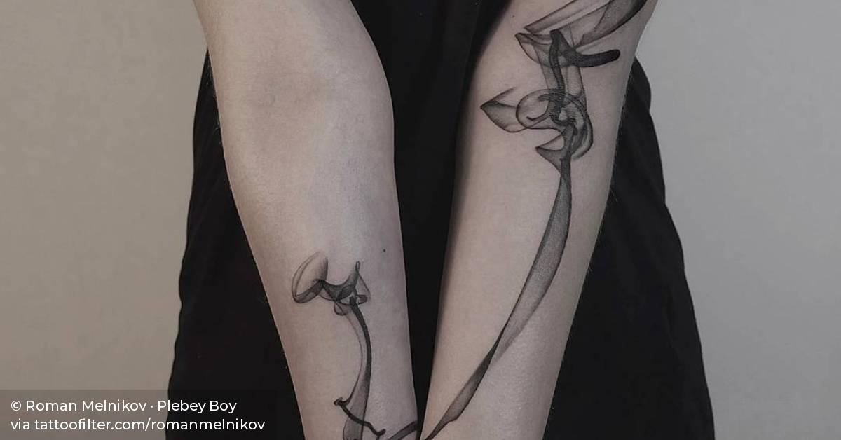 Matching smoke emulating abstraction tattoo on both