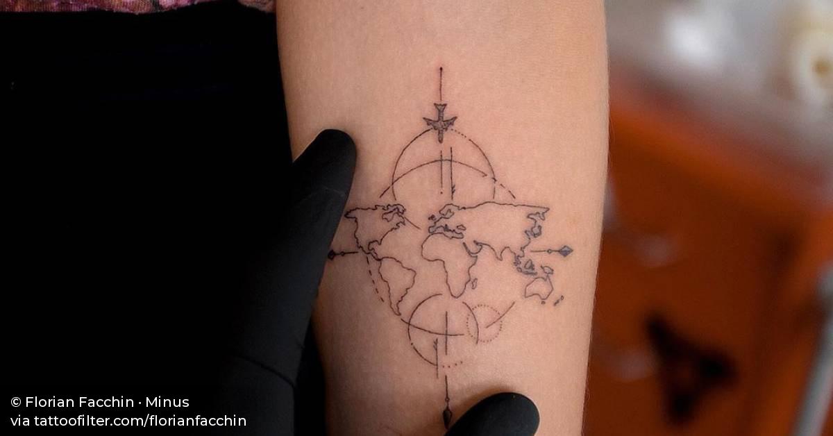 Fine line world map tattoo on the inner forearm.