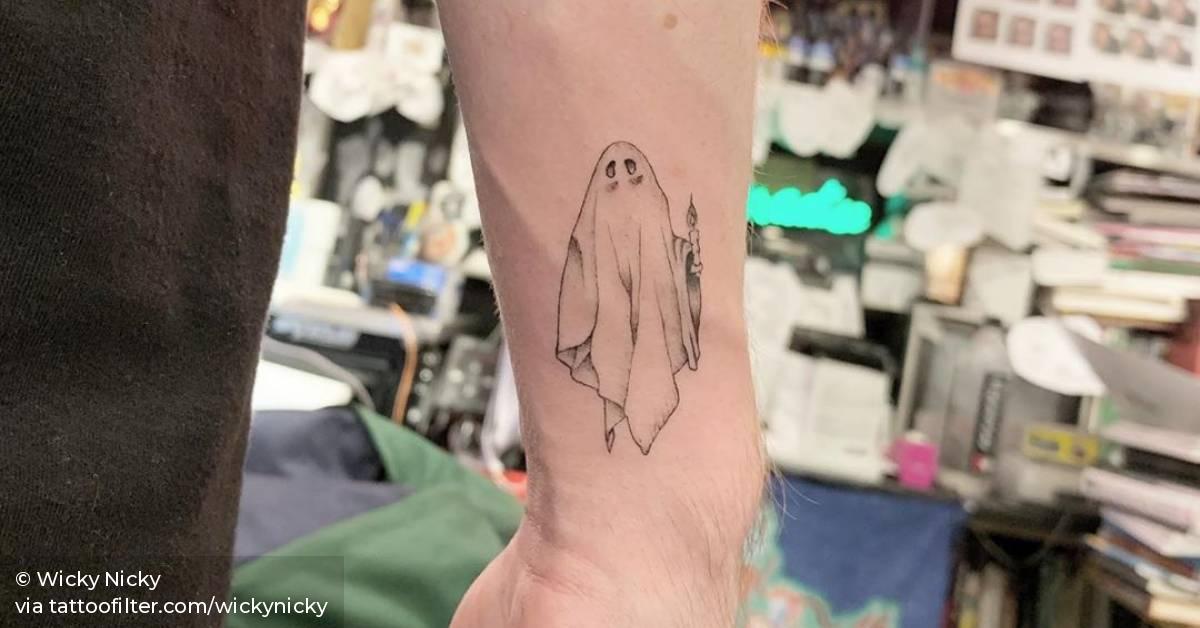 Ghost tattoo on the wrist.