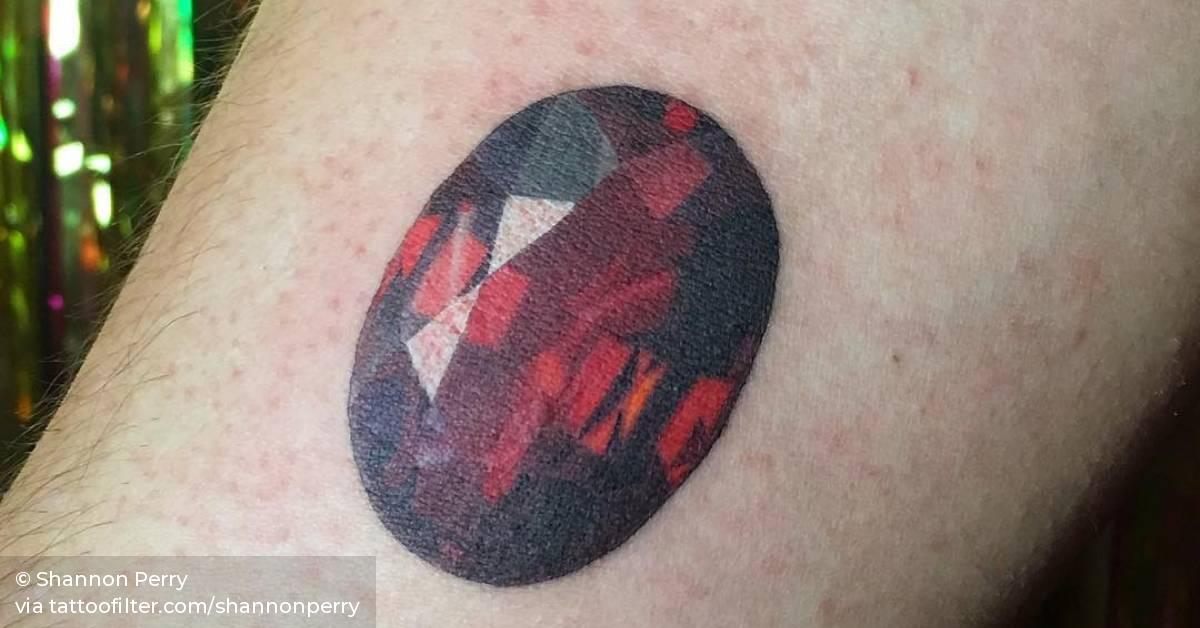 Ruby stone on the forearm.