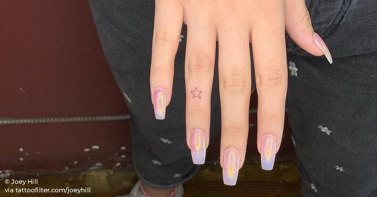 Small star outline on the finger.