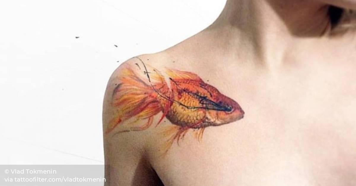 Goldfish tattoo on the right shoulder.