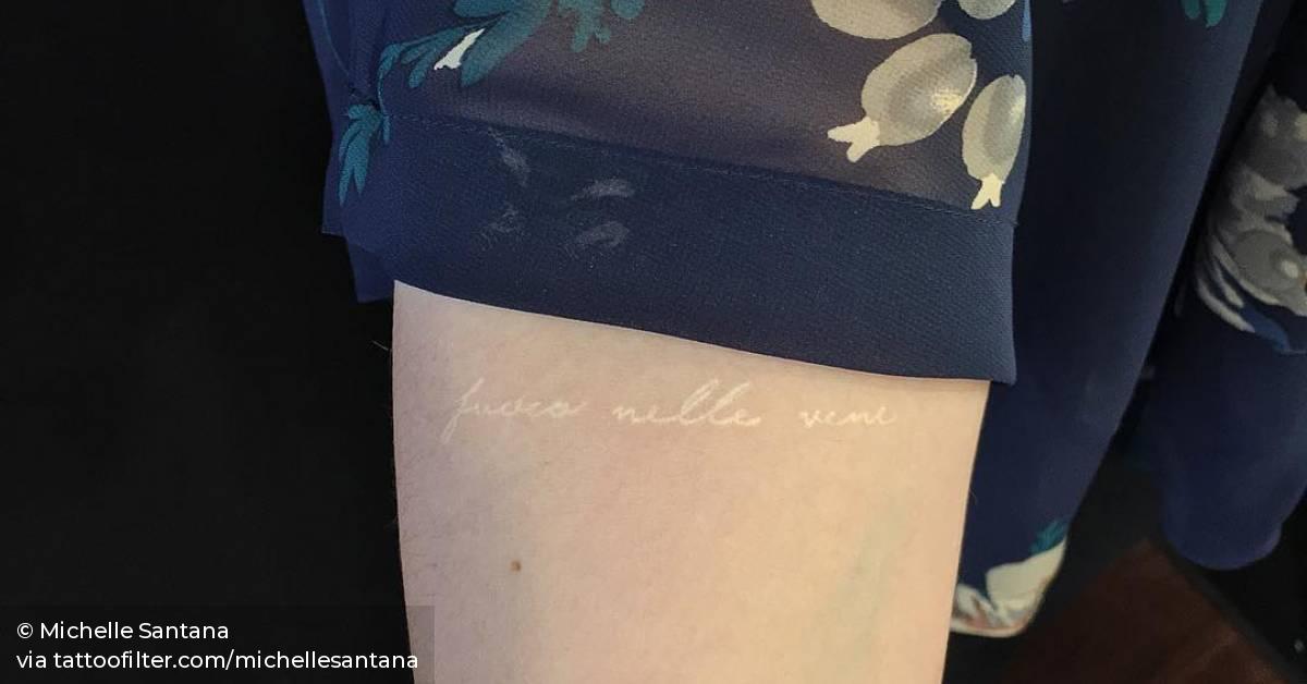 Healed "fuoco nelle vene" tattoo in white.