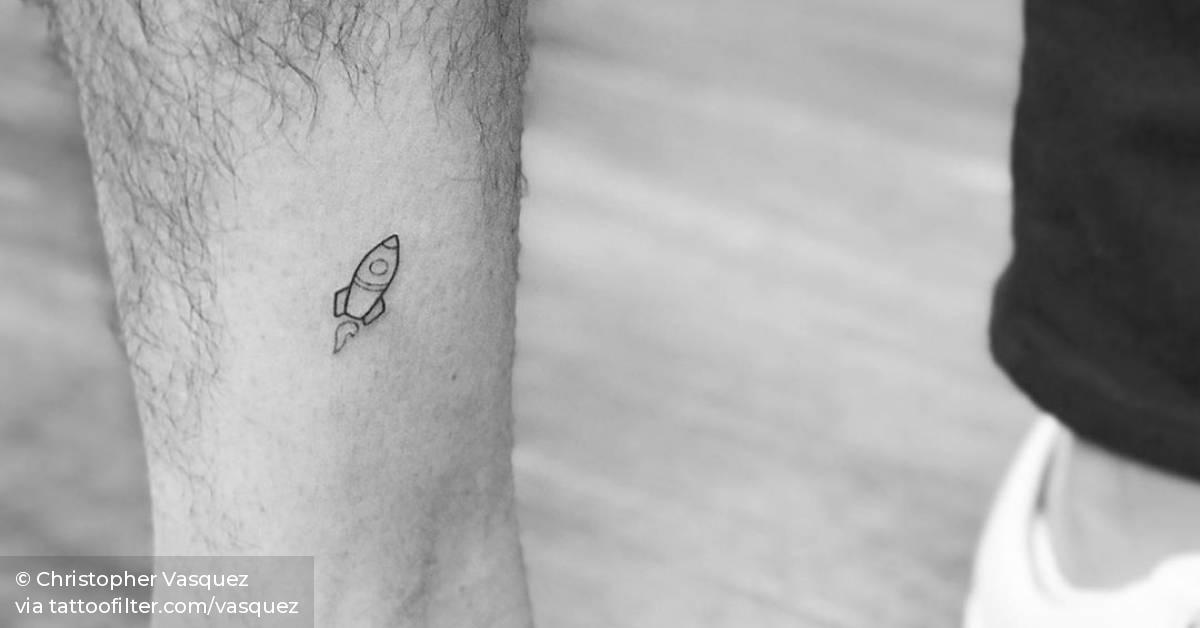 Minimalist rocket tattoo on the ankle.