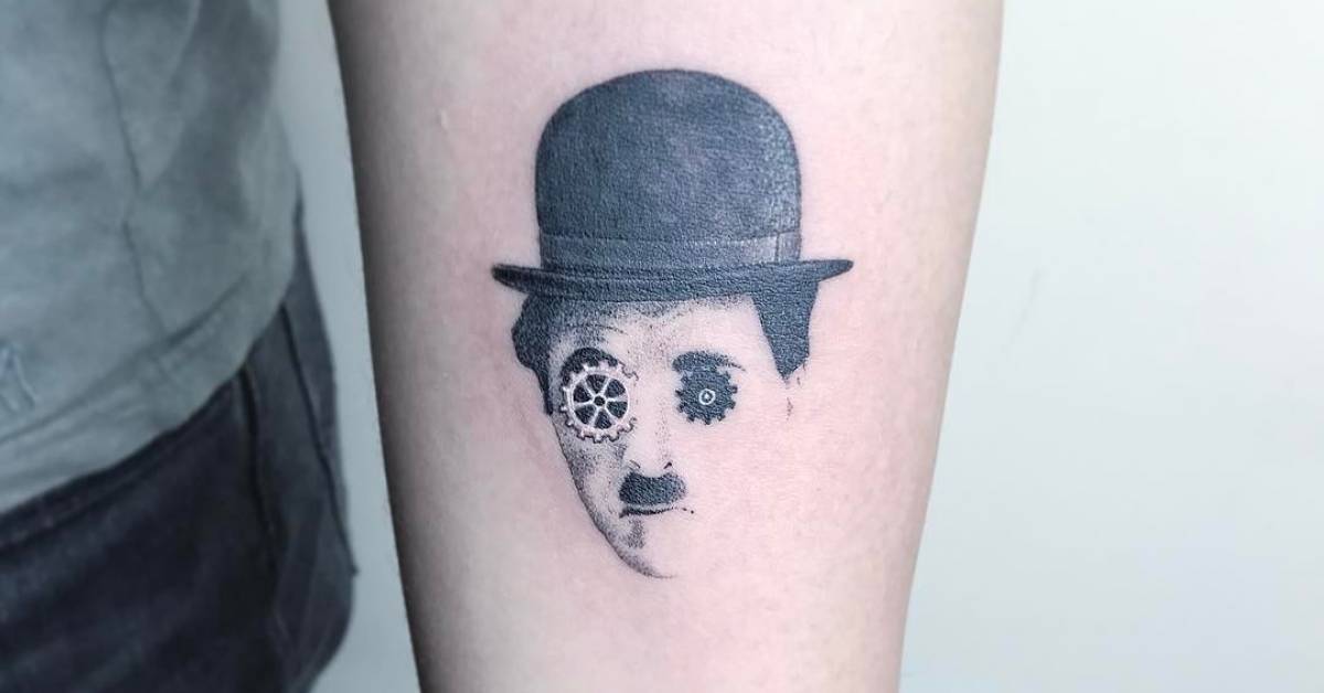 Charlie Chaplin portrait tattoo.
