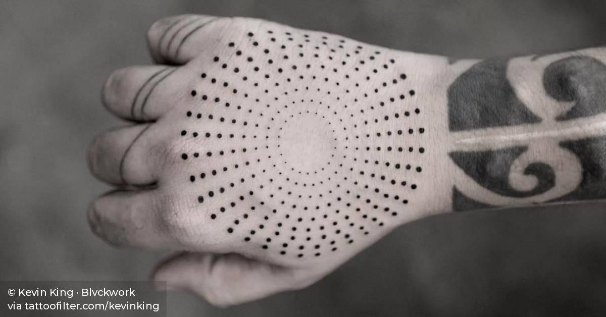 Op art style dots on the right hand.