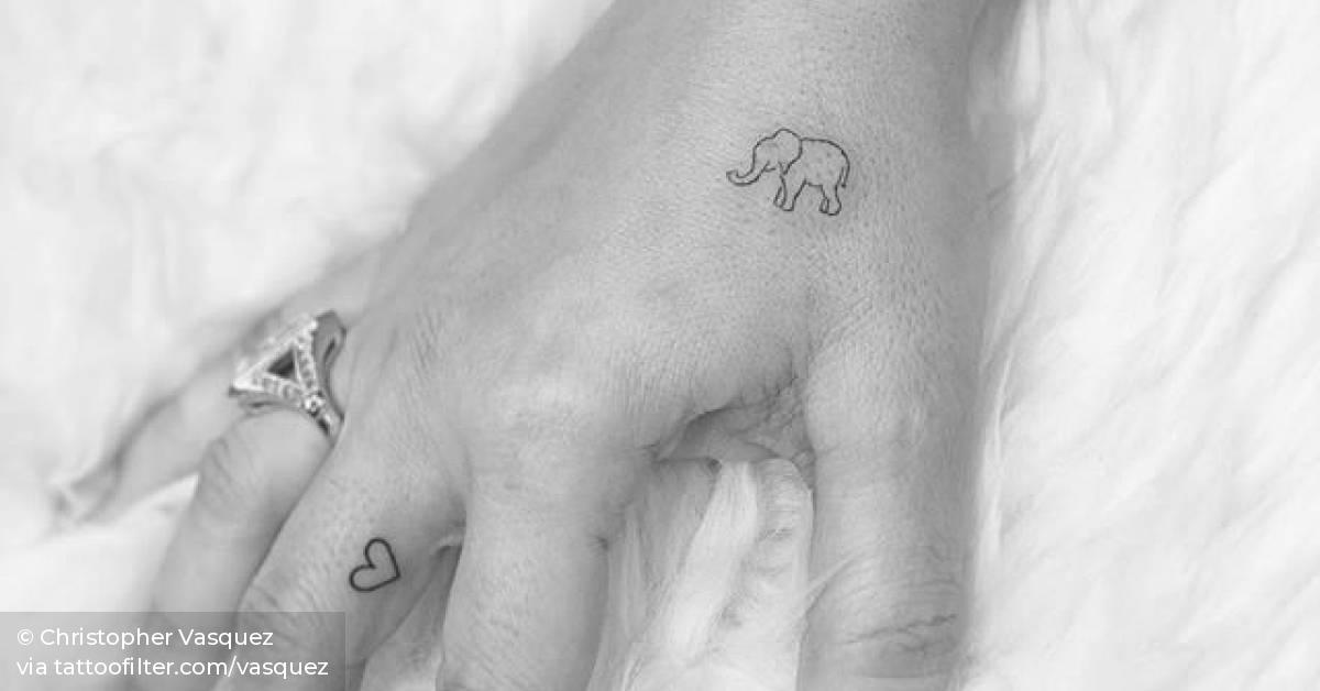 Elephant tattoo on the right hand.