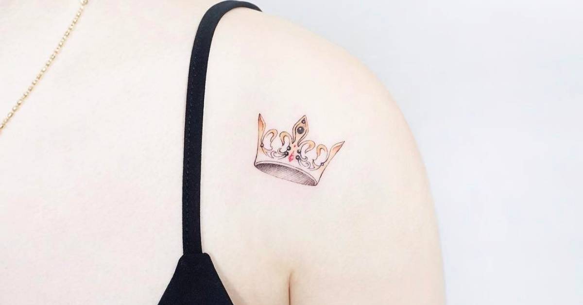 Crown tattoo on the left shoulder.