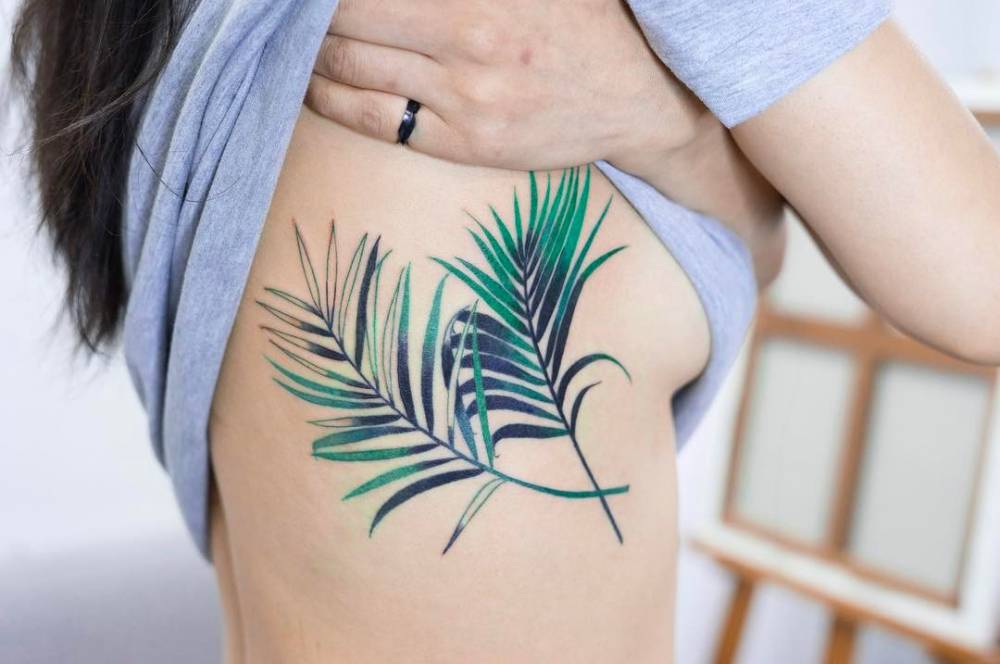 Palm Leaves Tattoo On The Right Ribcage 