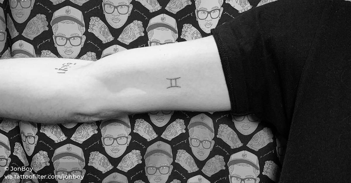 Gemini Zodiac symbol on the inner arm.