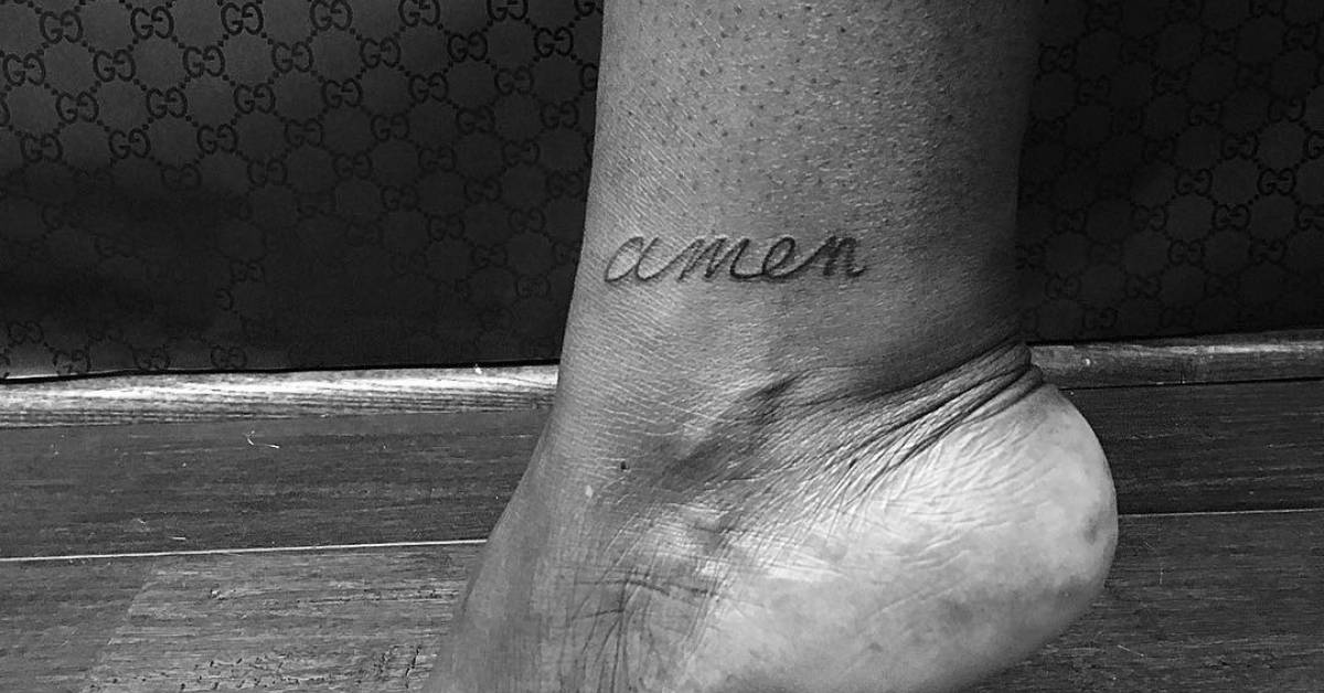 “Amen” tattoo on the right inner ankle bone.
