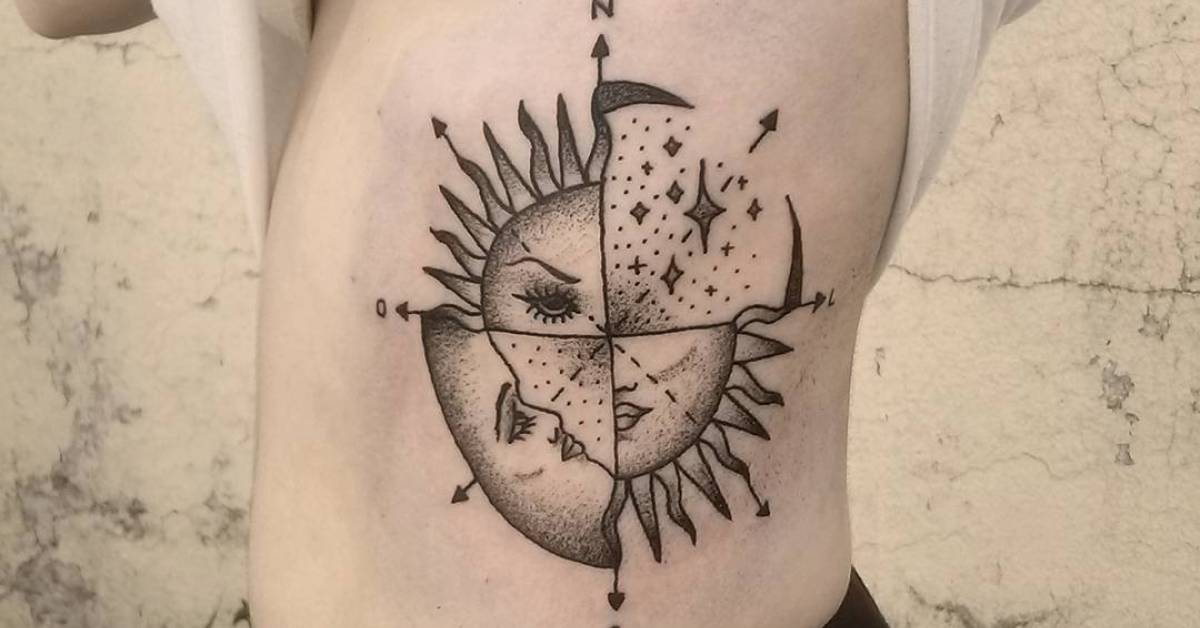 Moon/sun compass tattoo on the ribcage.
