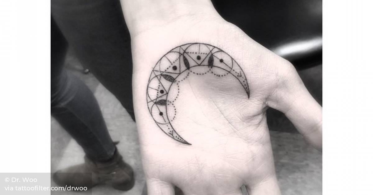 Geometric patterned moon on the hand.