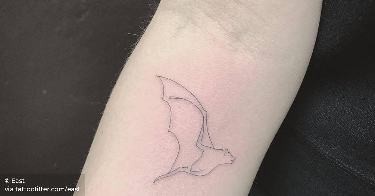 Continuous line bat tattoo on the inner forearm.