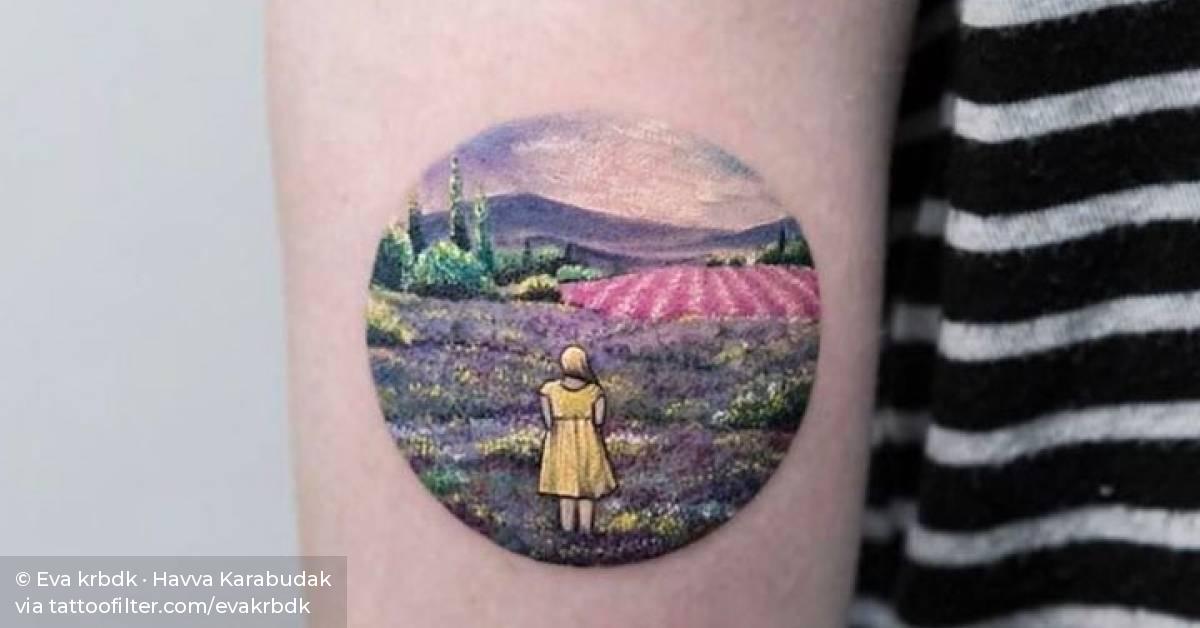 Child in a flower field circle tattoo on the right