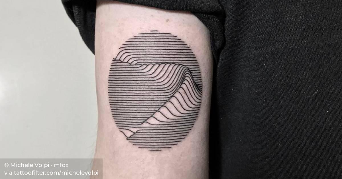 Geometric wave tattoo on the back of the left arm.