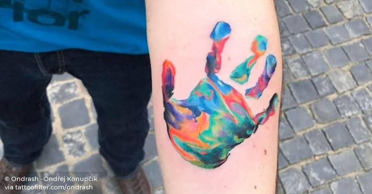 Abstract hand tattoo on the left inner forearm.