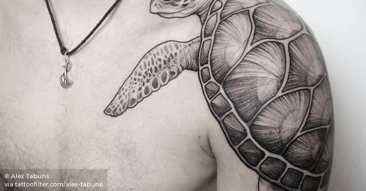 Turtle tattoo on the left shoulder.