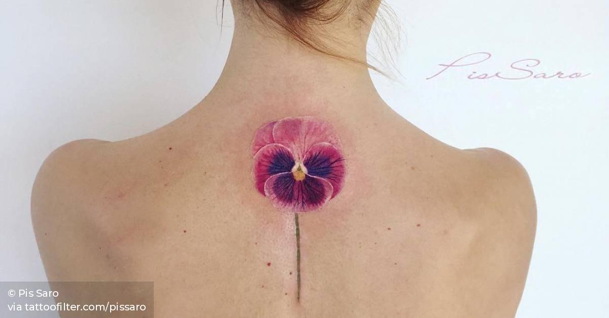 Pansy tattoo on the upper back.