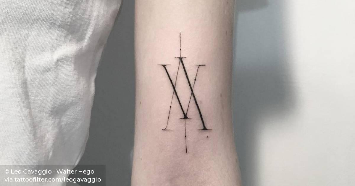 Monogram tattoo on the left monogram.