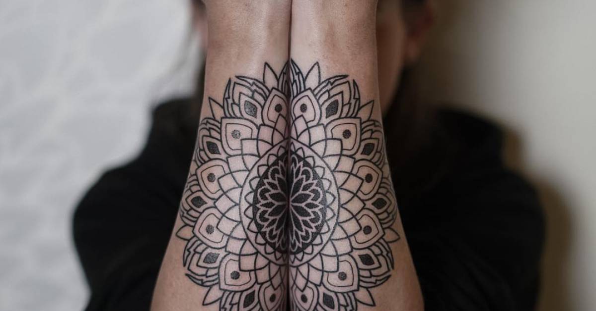 Matching mandala tattoo.