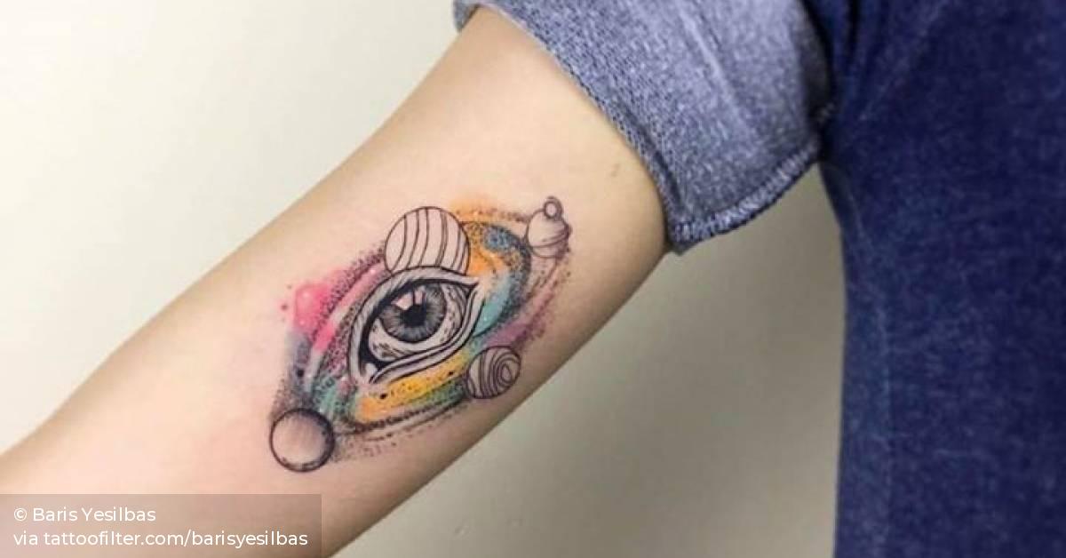Galactic eye tattoo on the right inner arm.