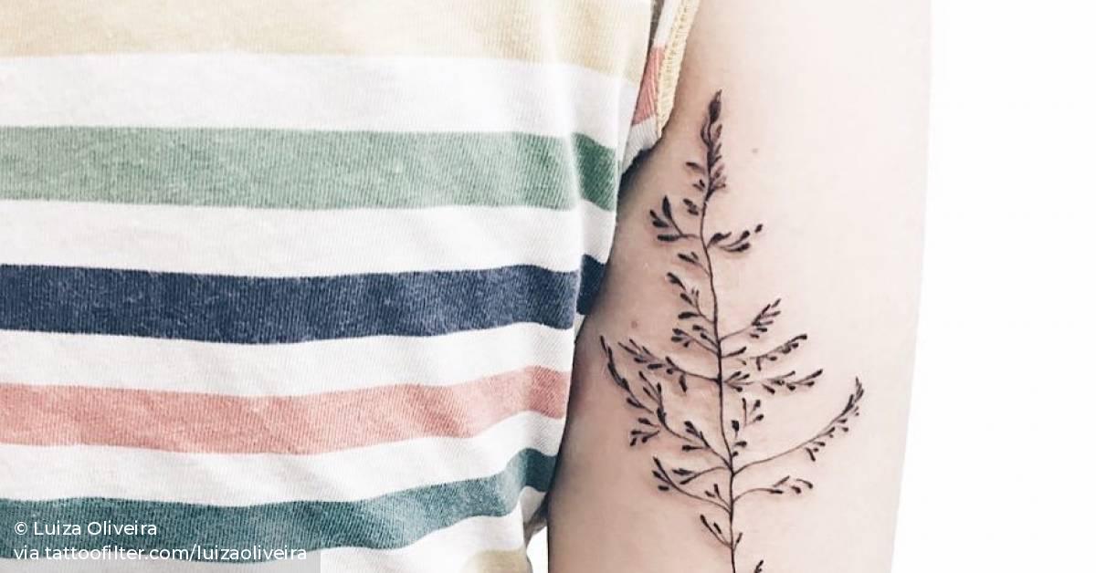 Grass tattoo on the back of the right arm.