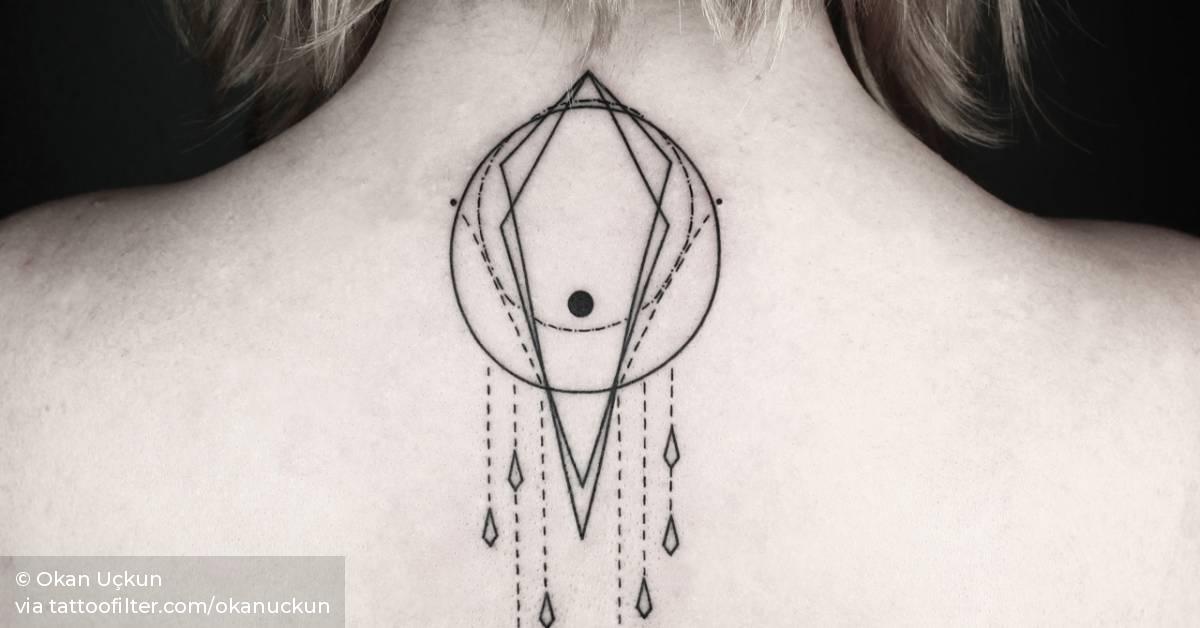 Geometric tattoo on the upper back.