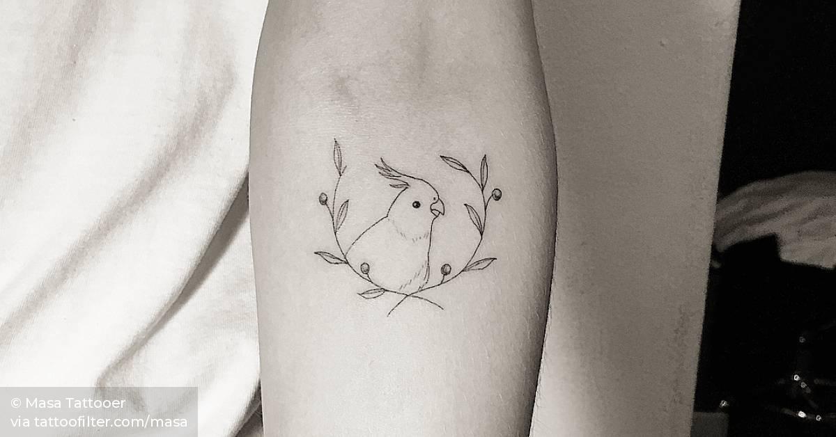 Cockatoo tattoo on the left inner forearm.