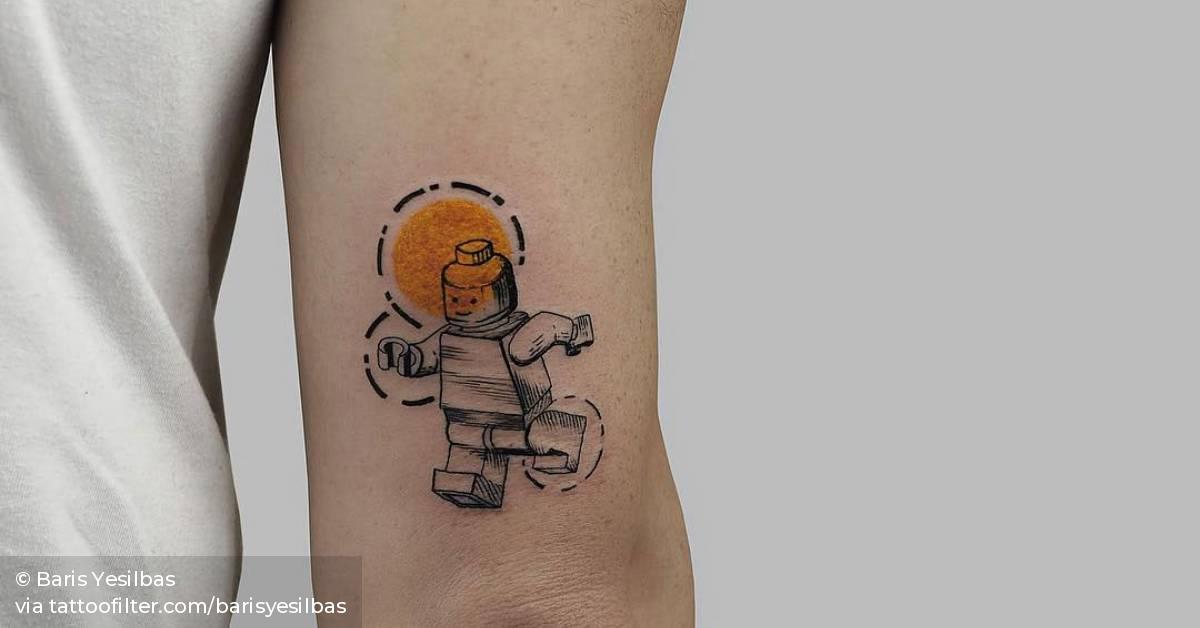 Lego tattoo on the back of the right arm.