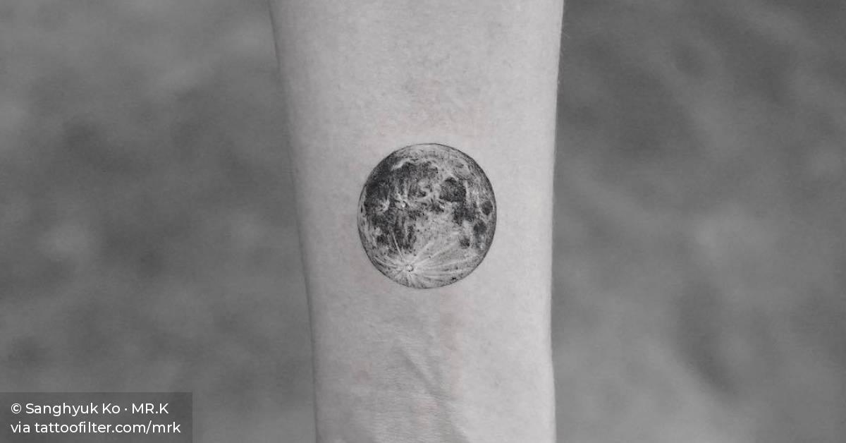 Fine line moon tattoo on the left inner forearm.