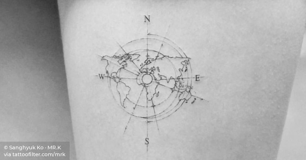 Single needle world map compass tattoo on the left