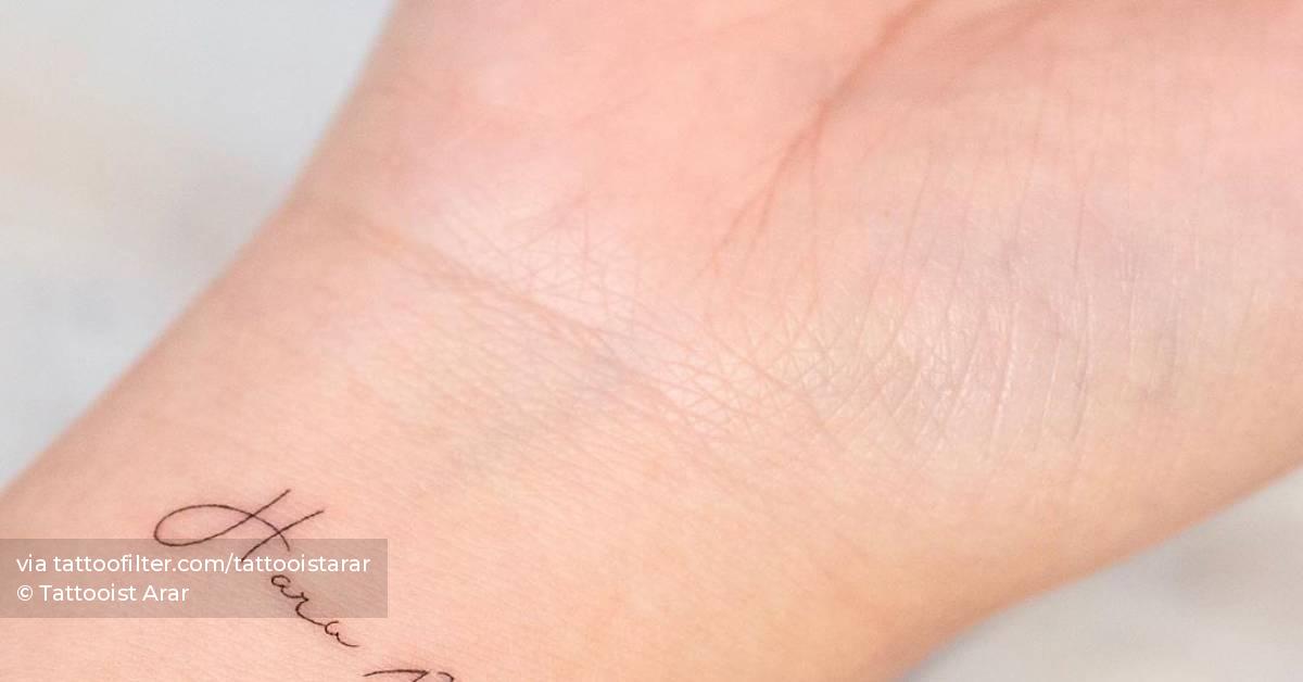 Lettering tattoo on wrist