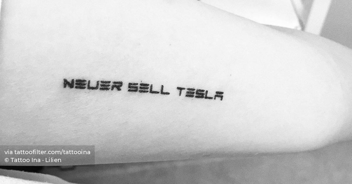 Lettering tattoo on inner arm